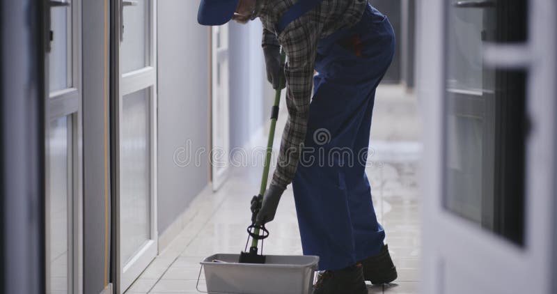 Janitor Cleaning a Corridor Stock Image - Image of working, hallway ...