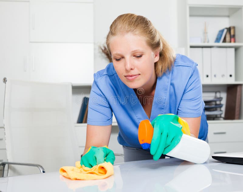 Janitor Cleaning Desk in Office Stock Image - Image of person, formal ...