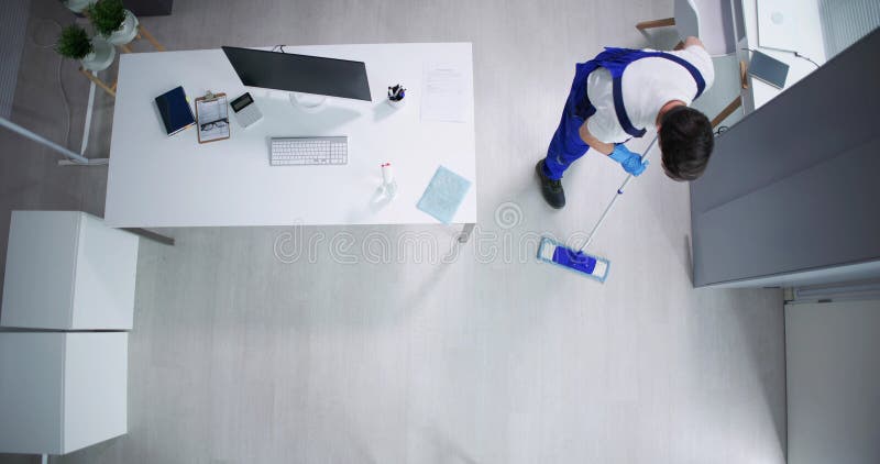 Janitor Cleaning White Desk Stock Photo - Image of workplace, view ...
