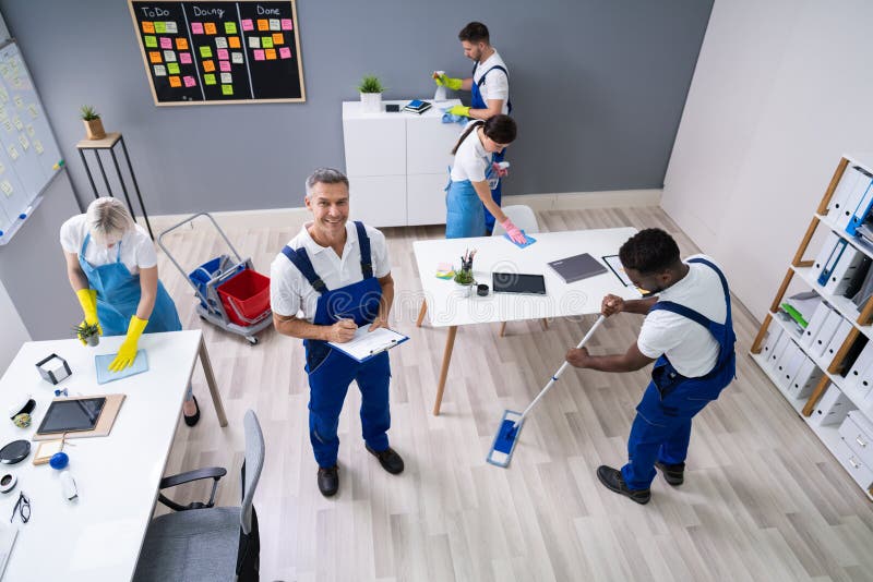 Janitor with His Team in Office Stock Image - Image of high, colleague ...