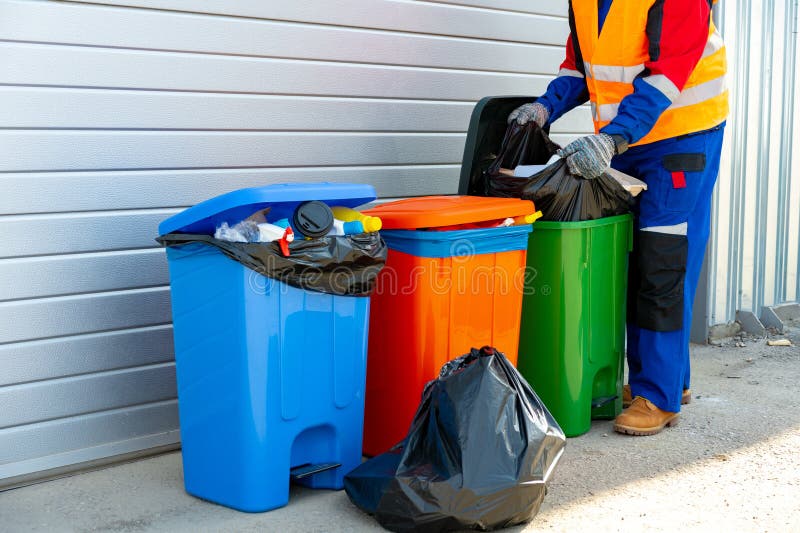 Janitor Takes Garbage Out of Trash Container Outdoors Stock Photo ...