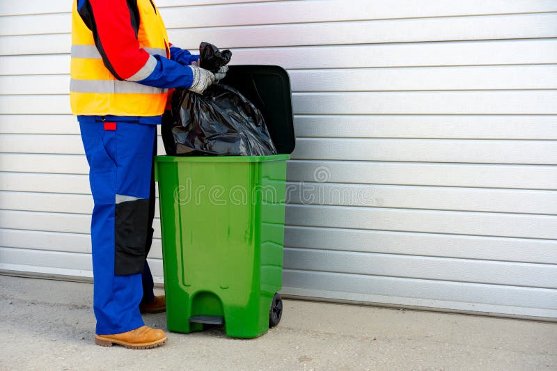 Janitor Takes Garbage Out of Trash Container Outdoors Stock Photo ...