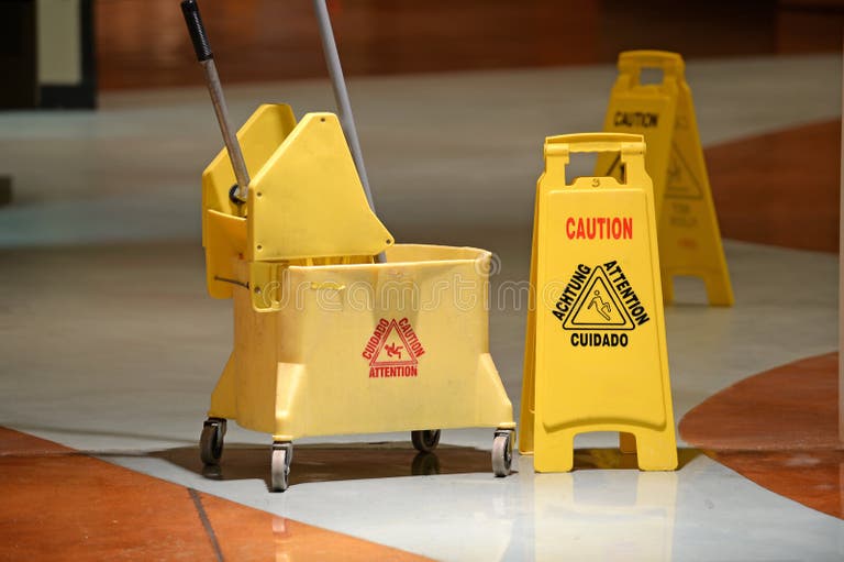 Janitorial Mop and Caution Sign Stock Photo - Image of cleaner, slip ...