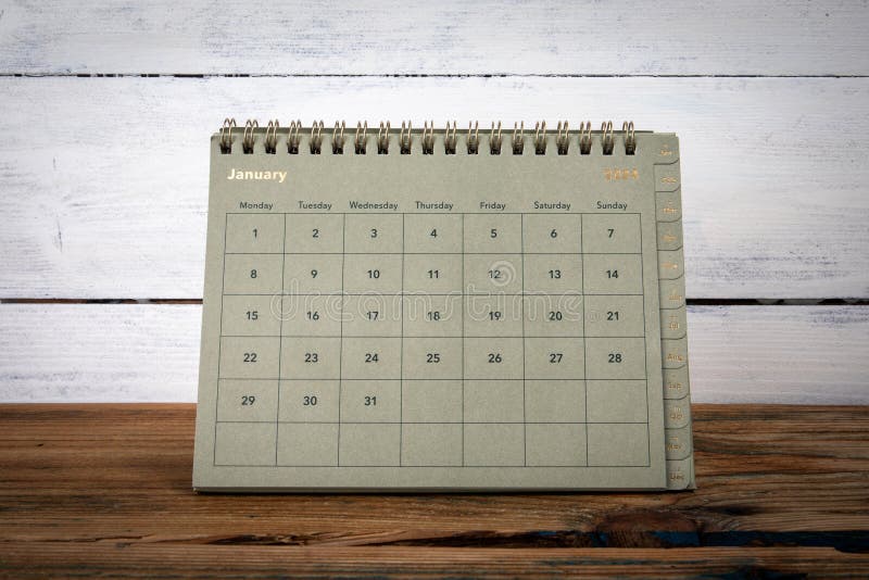 JANUARY 2024 Cardboard Desk Calendar and Planner on a Wooden Texture ...