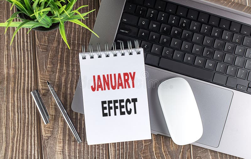 JANUARY EFFECT Text on a Notebook with Laptop, Mouse and Pen . Stock ...