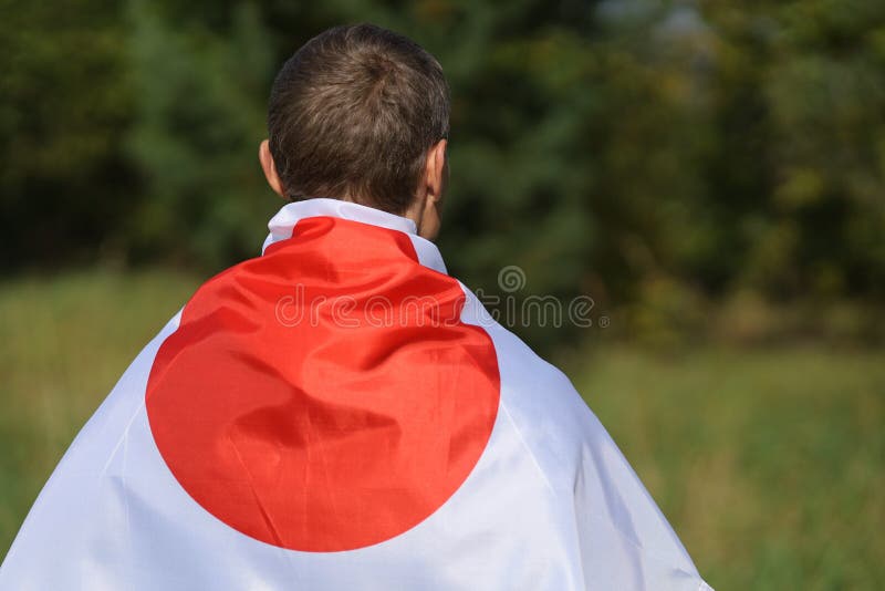 Japan flag on a man`s back stock photo. Image of wind - 253509160