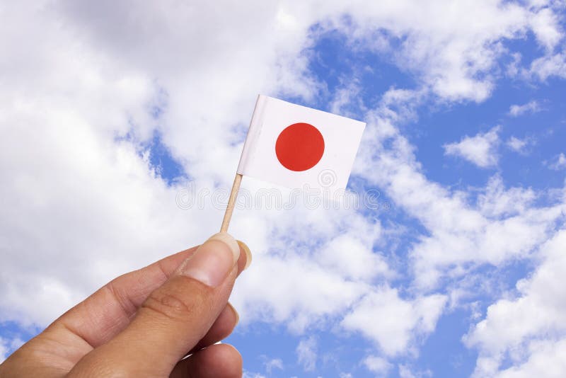 Japan Small Flag on Blue Sky Background Stock Photo - Image of ...