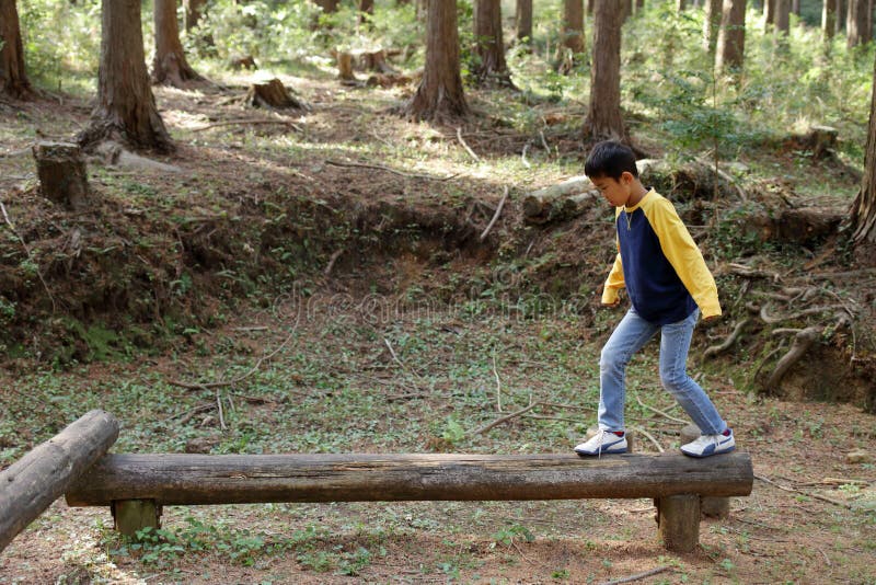 Japanese Boy on the Balance Beam Stock Image - Image of play, beam ...