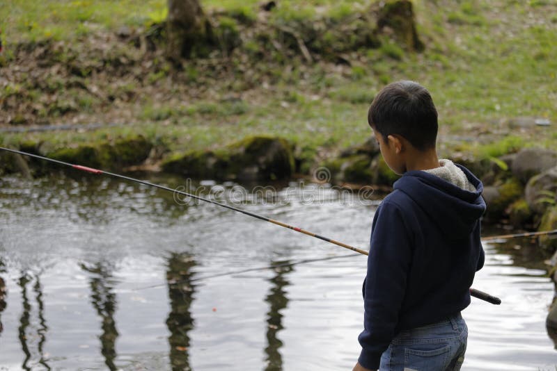 Boy Catching Fish Stock Photos - Download 1,086 Royalty Free Photos