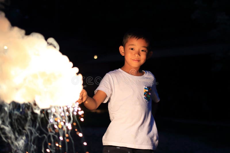 Japanese Boy Doing Handheld Fireworks Stock Photo - Image of seven ...