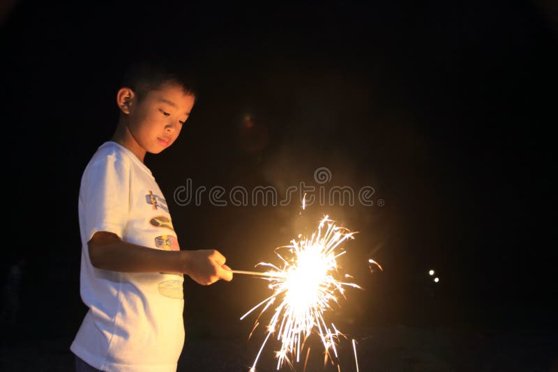 Japanese Boy Doing Handheld Fireworks Stock Image - Image of smile ...