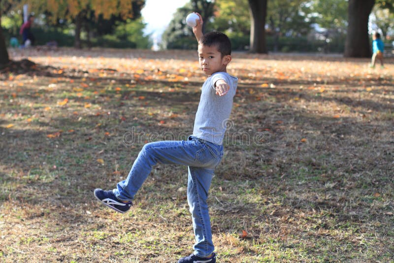 Japanese boy playing catch stock photo. Image of grader - 80867996