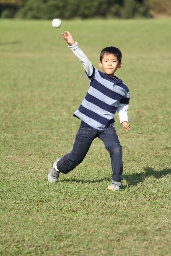 Japanese boy playing catch stock photo. Image of outside - 103765226