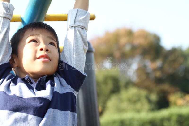 Japanese Boy Playing with a Monkey Bars Stock Image - Image of child ...