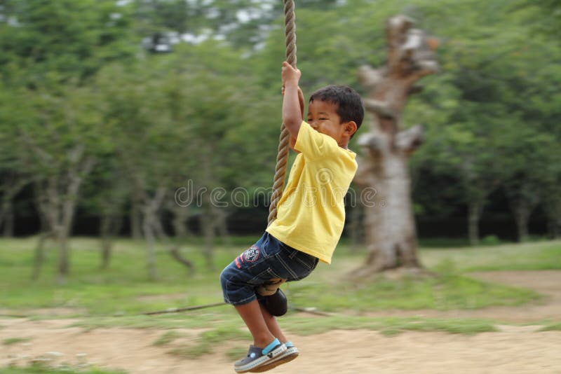 Japanese Boy Playing with Tarzan Rope Stock Image - Image of cute, face ...