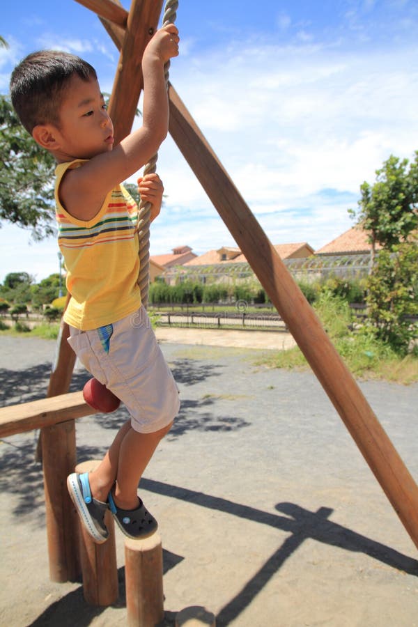 Japanese Boy Playing with Tarzan Rope Stock Image - Image of male ...