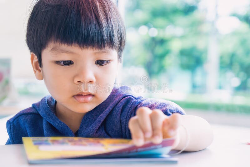 Japanese Boy is Reading a Educational Book. Stock Photo - Image of ...