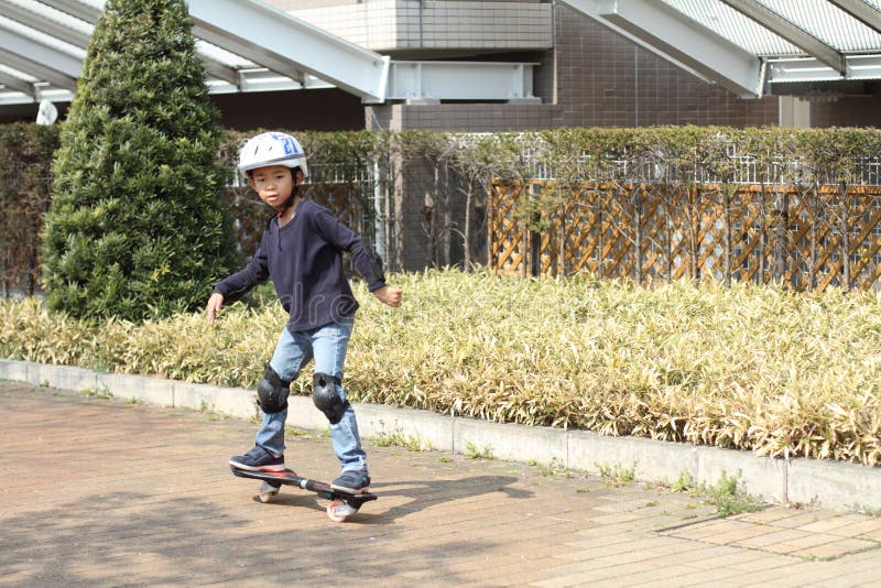 Japanese Boy Riding on a Casterboard Stock Image - Image of ride, seven ...