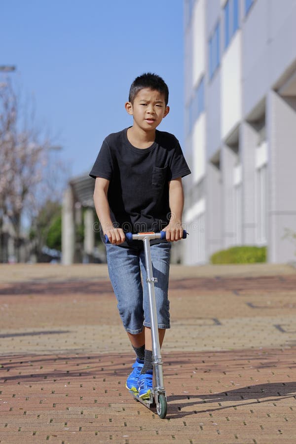 Japanese Boy Riding on a Scooter Stock Image - Image of smile ...