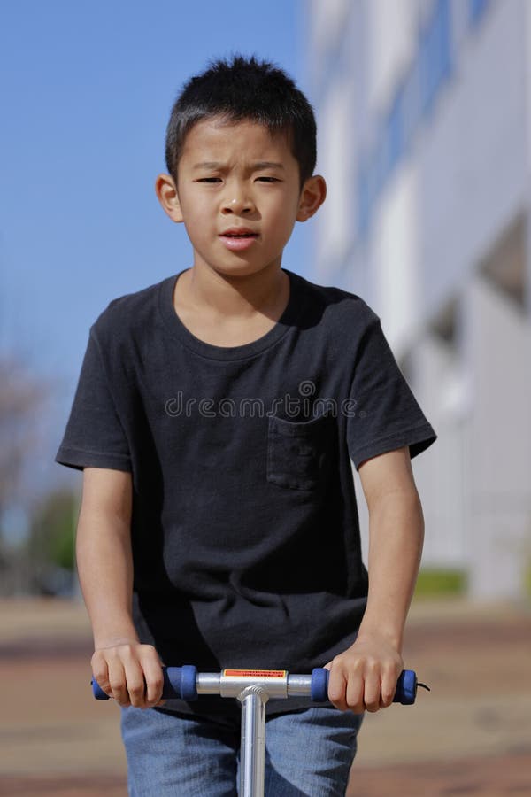 Japanese Boy Riding on a Scooter Stock Photo - Image of student ...