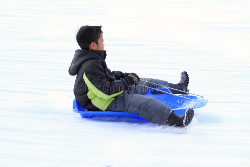 Japanese boy on the sled stock image. Image of child - 108915537