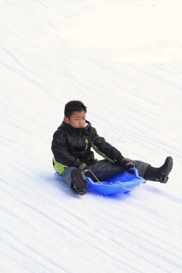 Japanese boy on the sled stock photo. Image of japanese - 108915544