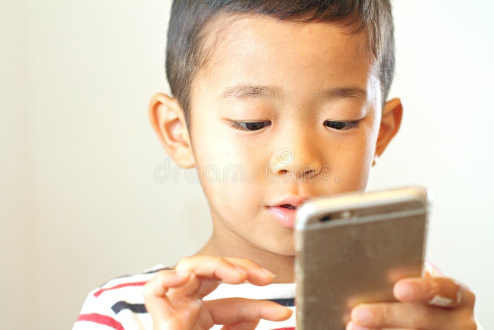 Japanese Boy Using a Smart Phone Stock Photo - Image of mobile, smile ...