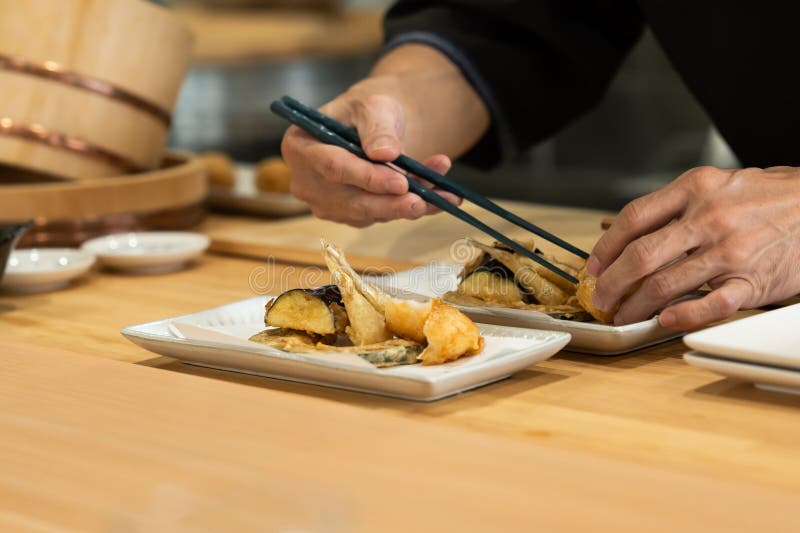 Japanese Chef Carefully Plating Tempura Vegetables and Seafood Using ...