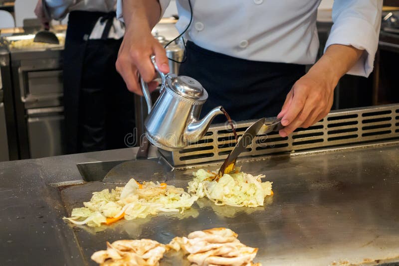 Chef Cooking Meat and Vegetable in Teppanyaki Restaurant Stock Photo ...