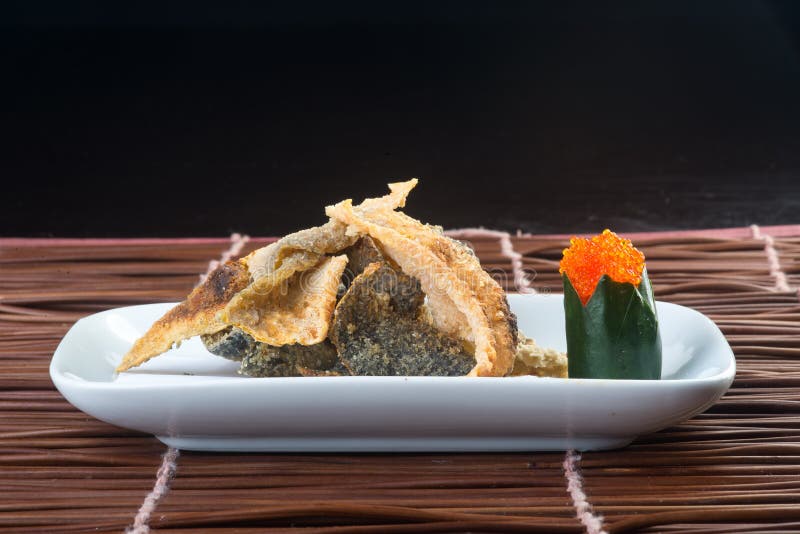 Japanese Cuisine. Fried Fish Skin on the Background Stock Photo - Image ...