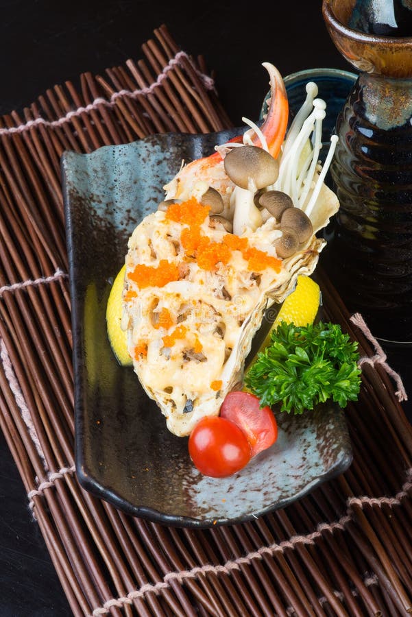 Japanese Cuisine. Grilled Shell Fish on the Background Stock Photo ...