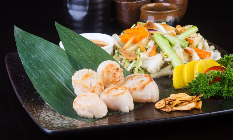 Japanese Cuisine. Grilled Shell Fish on the Background Stock Image ...