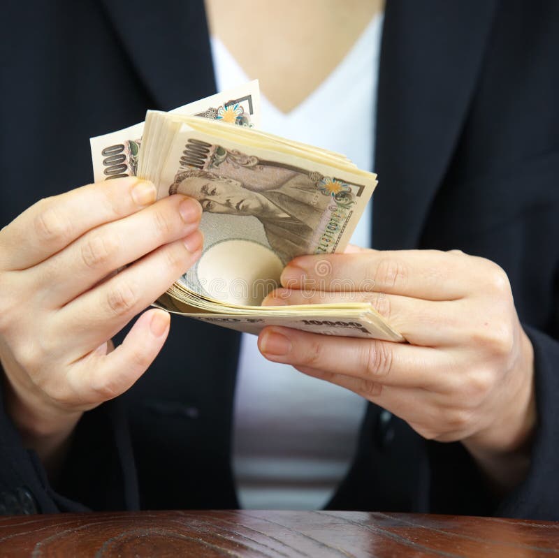 Japanese currency note stock photo. Image of hands, nippon - 35377310