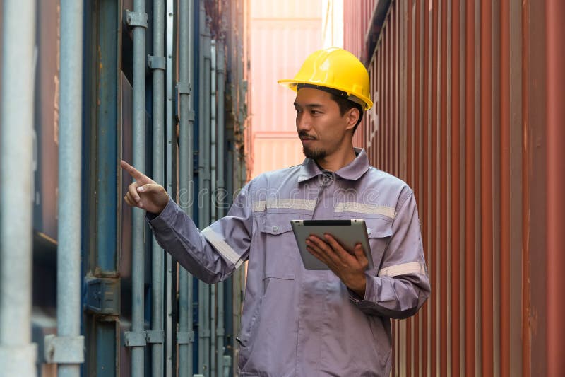 Japanese Engineer Working at International Shipping Cargo Yard. Man in ...