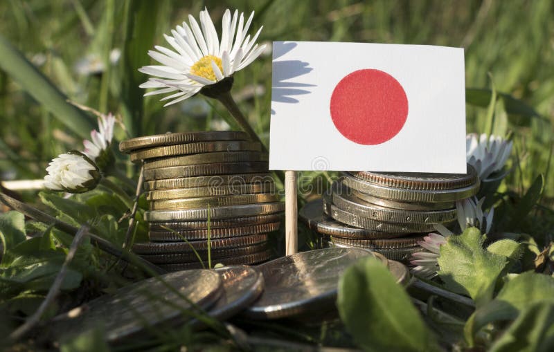 Japanese Flag with Stack of Money Coins with Grass Stock Image - Image ...