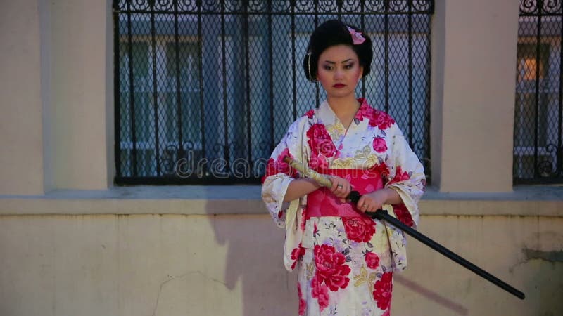 Japanese geisha with sword stock video footage. Video of adult - 36757382
