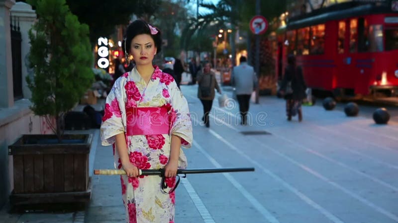 Japanese geisha with sword stock video footage. Video of adult - 36757382