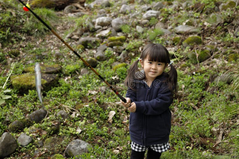 Japanese Girl Catching Fish Stock Image - Image of person, cute: 149023261