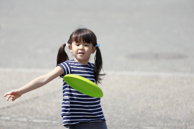 Japanese Girl Playing Flying Disc Stock Photo - Image of open, play ...