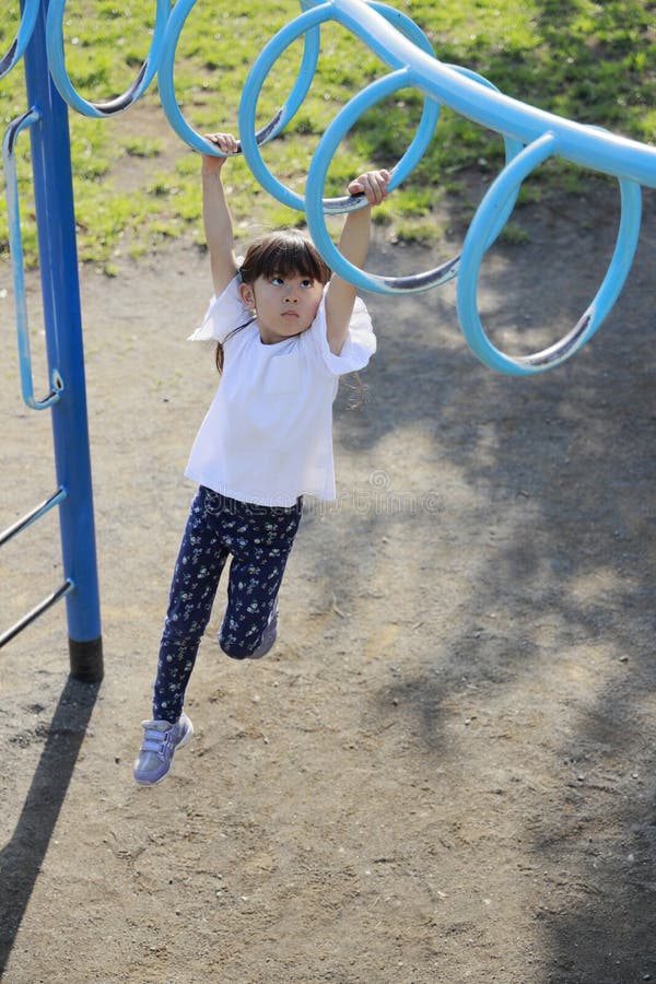 Japanese Girl Playing with a Monkey Bars Stock Photo - Image of play ...