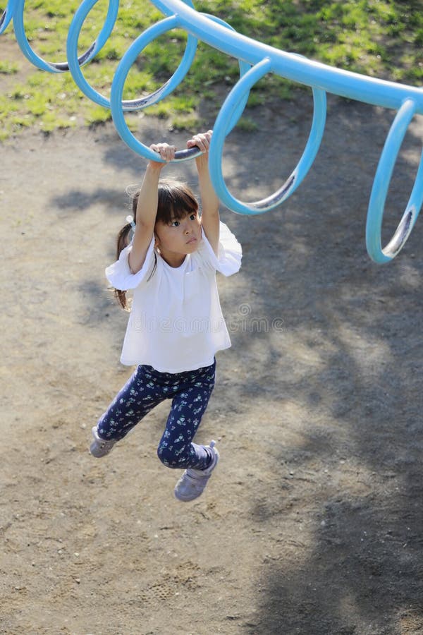 Japanese Girl Playing with a Monkey Bars Stock Photo - Image of park ...