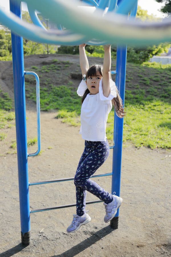 Japanese Girl Playing with a Monkey Bars Stock Photo - Image of female ...