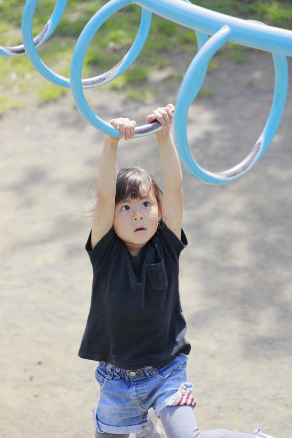 Japanese Girl Playing with a Monkey Bars Stock Photo - Image of ...