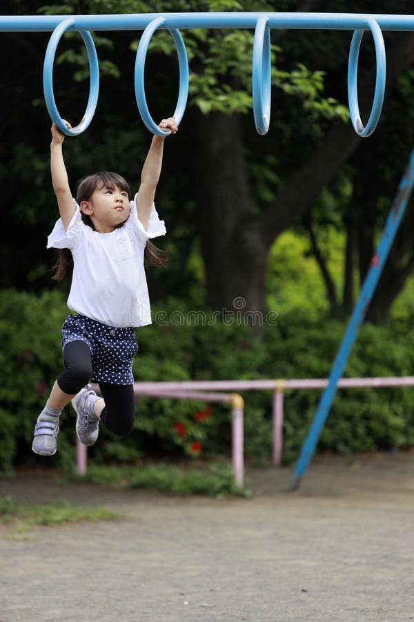 Japanese Girl Playing with a Monkey Bars Stock Image - Image of smile ...