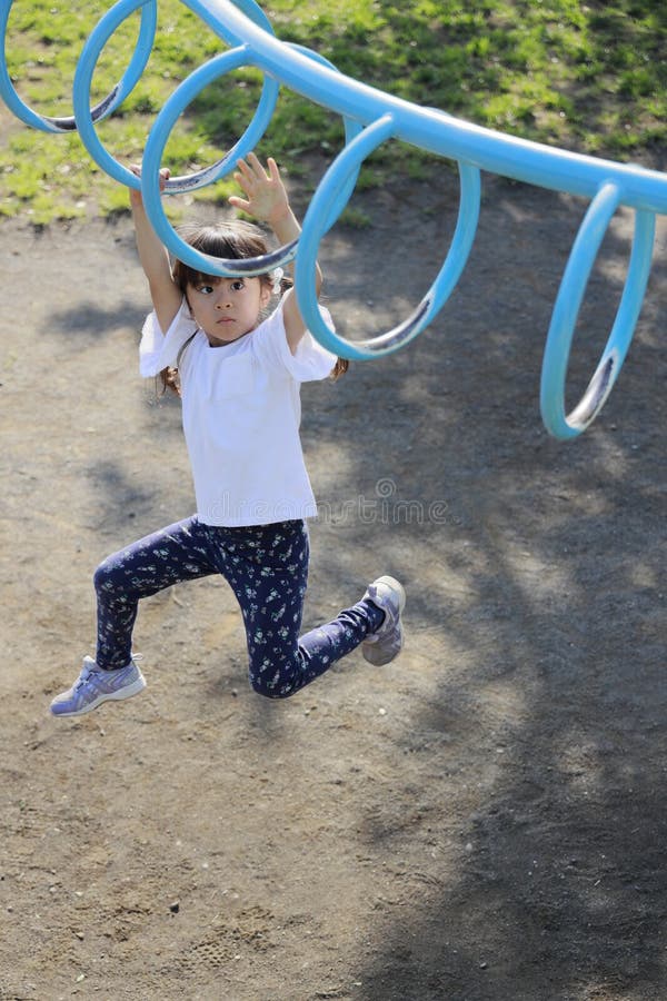 Japanese Girl Playing with a Monkey Bars Stock Image - Image of ...