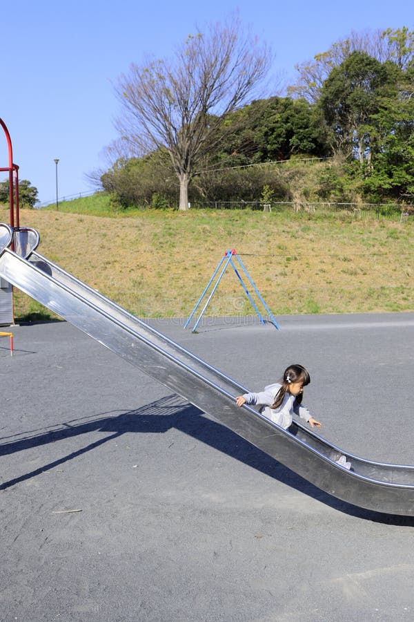 Japanese girl on the slide stock photo. Image of sunny - 182620912