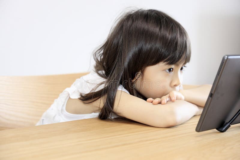 Japanese Girl Watching Video on Tablet PC Stock Image - Image of ...