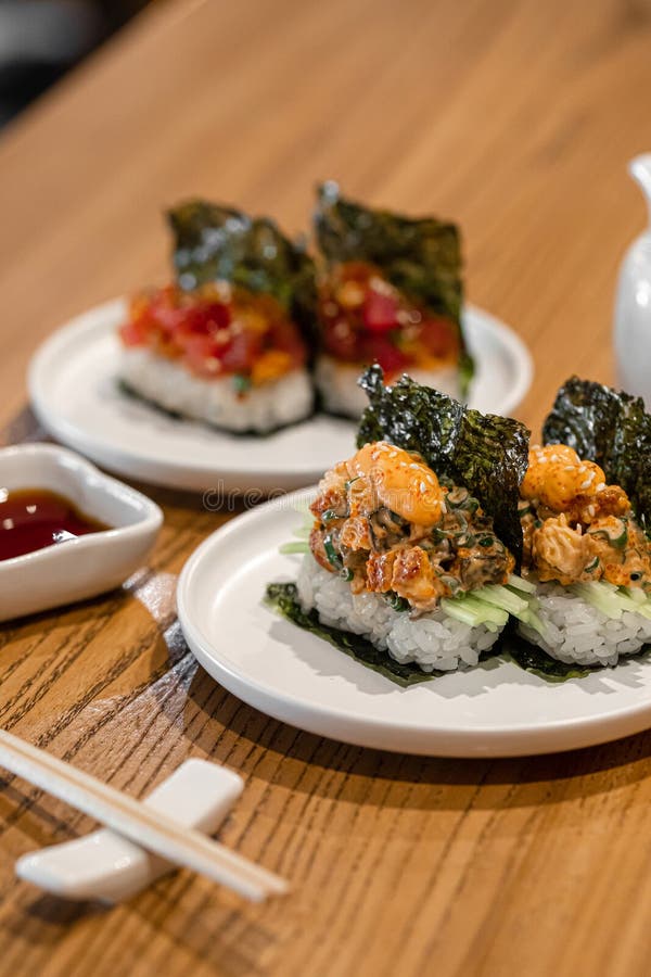 Japanese Hand Sushi Rolls with Different Fish and Sauce Stock Photo ...