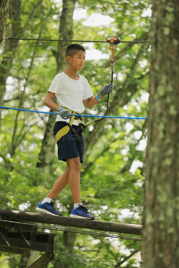 Japanese Junior High School Student Playing at Outdoor Obstacle Course ...