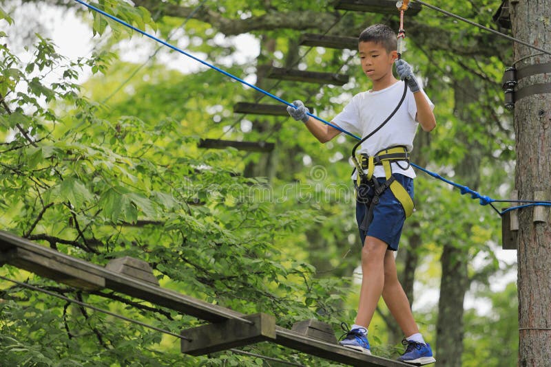 Japanese Junior High School Student Playing at Outdoor Obstacle Course ...